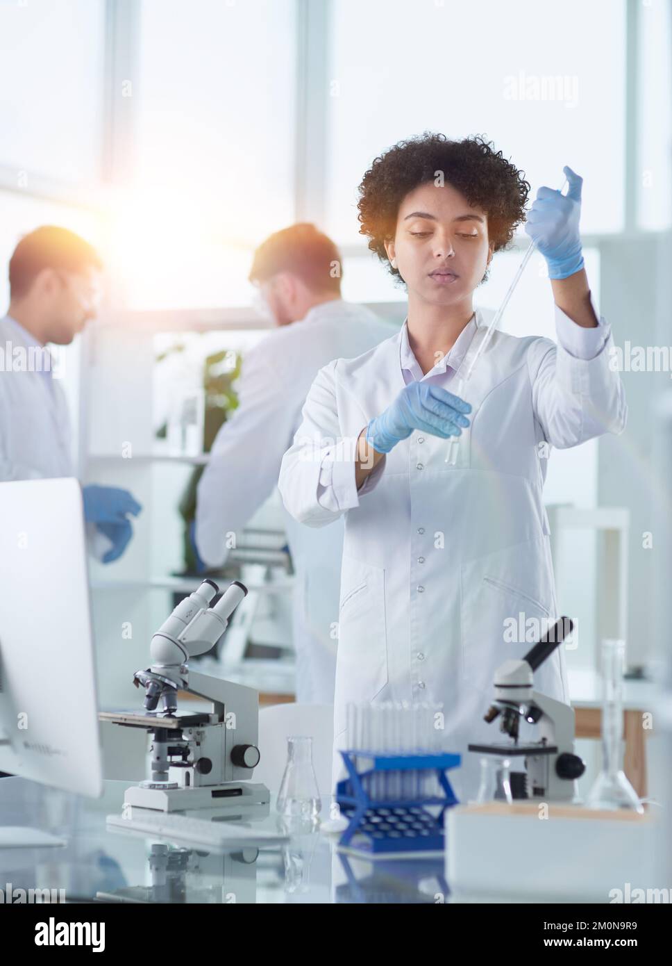 Scientists looking camera in laboratory hi-res stock photography and ...