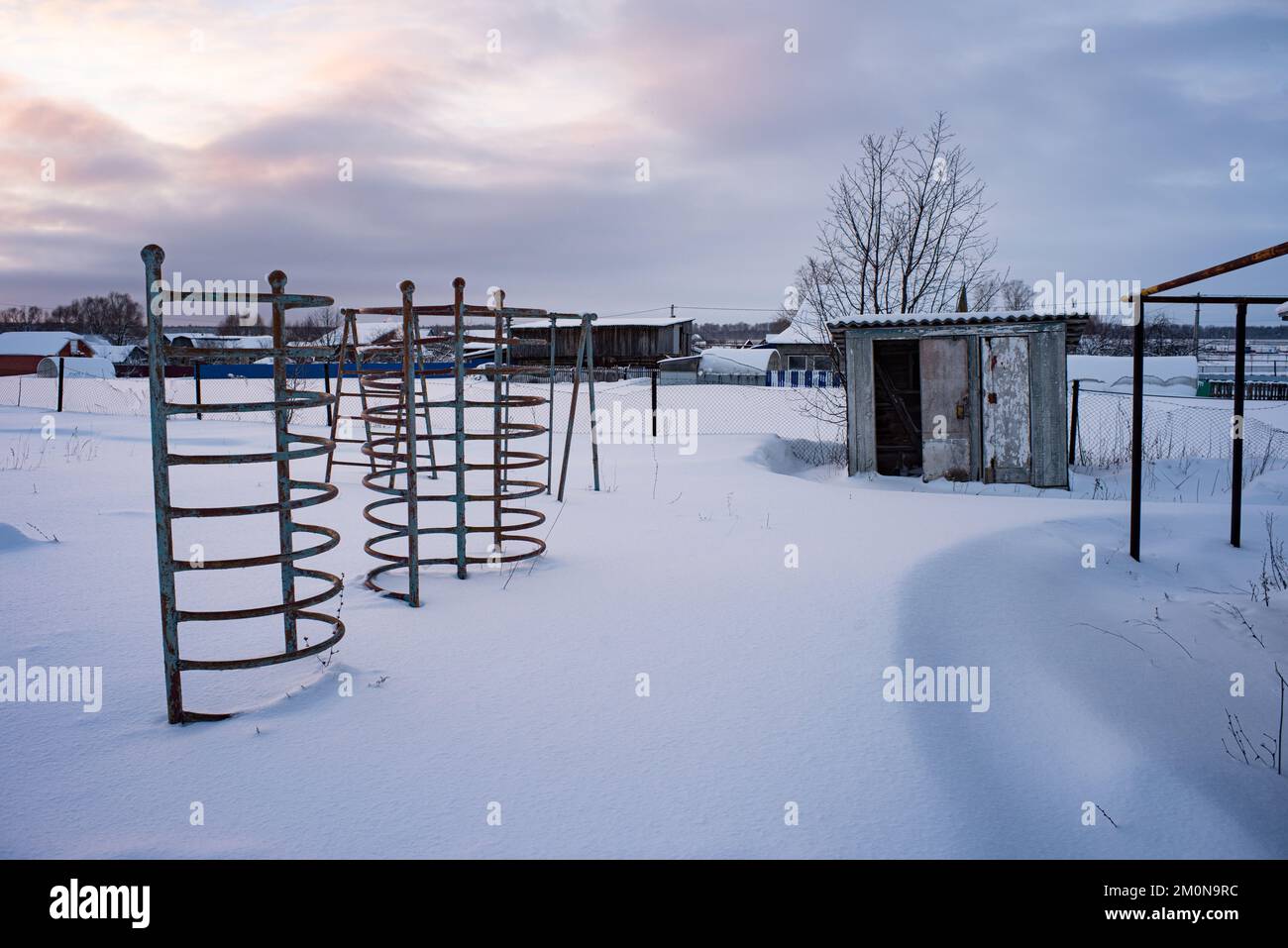 Abandoned playground and outdoor toilet covered with snow Stock Photo ...