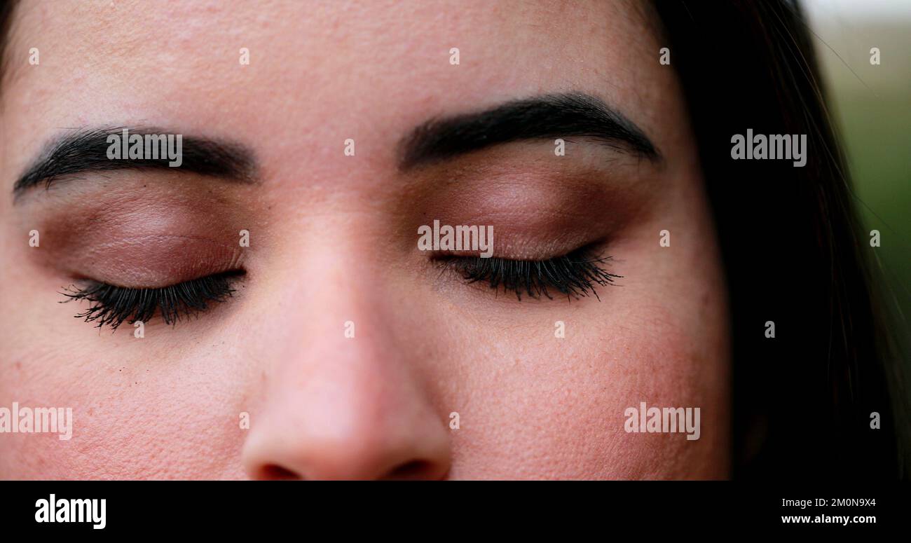 Young woman meditating outside, person opening eyes awakening Stock ...