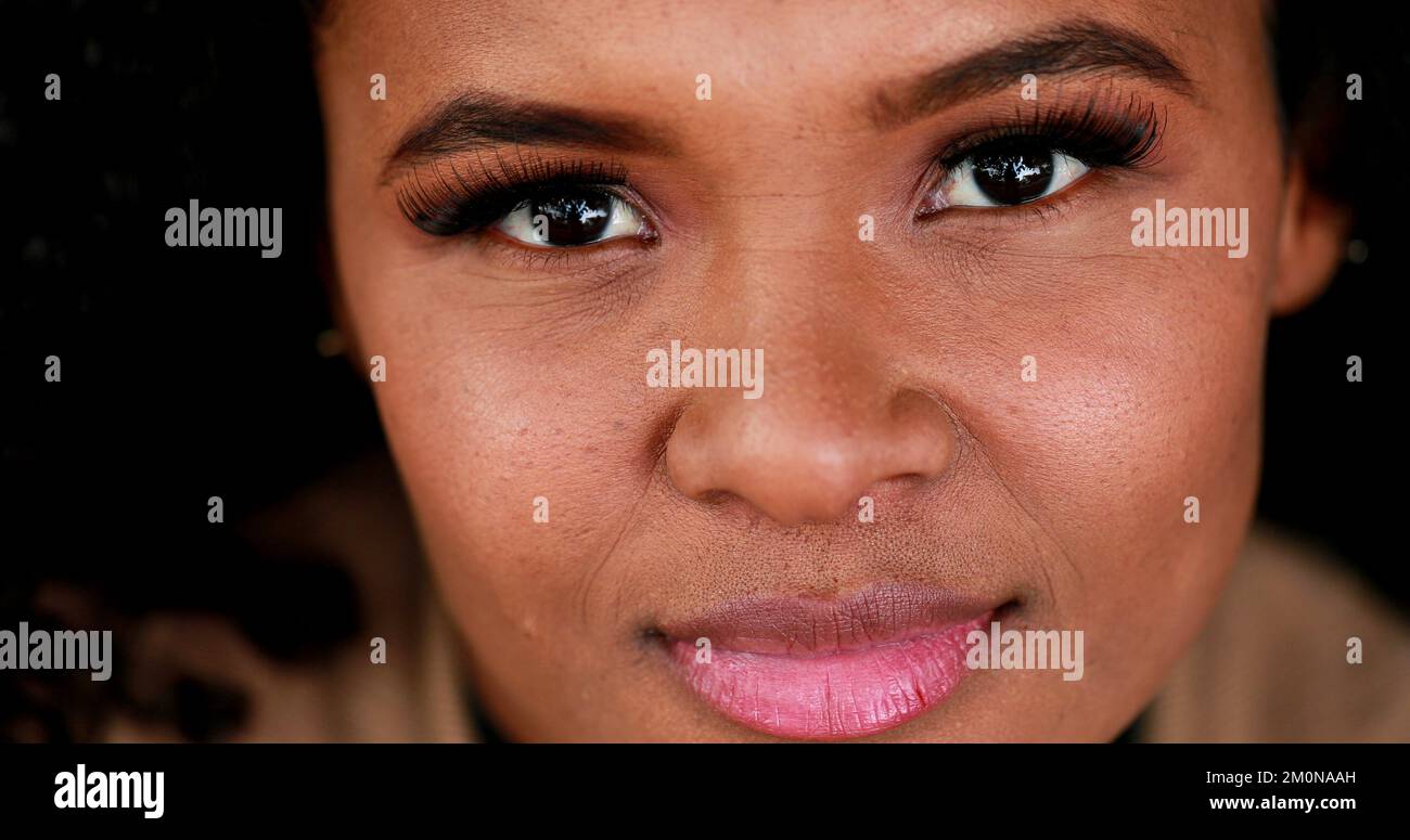 Young black woman close-up face staring at camera Stock Photo - Alamy