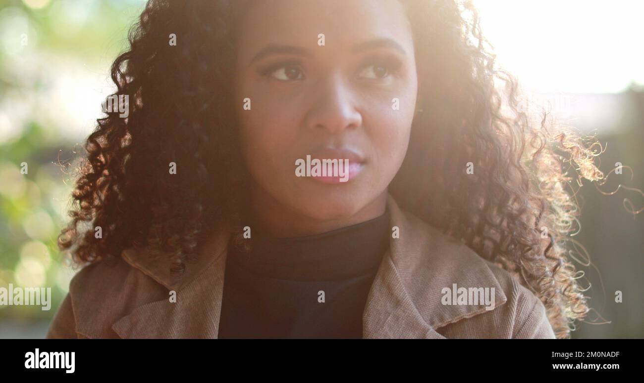 Uncertain Black Woman Feeling Overwhelmed Fidgeting With Hands Stock