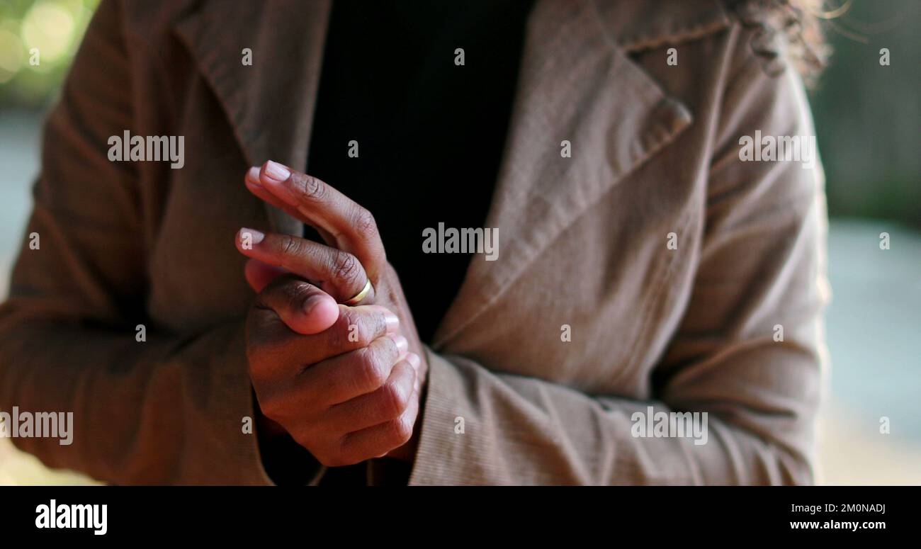 Uncertain black woman feeling overwhelmed fidgeting with hands Stock ...