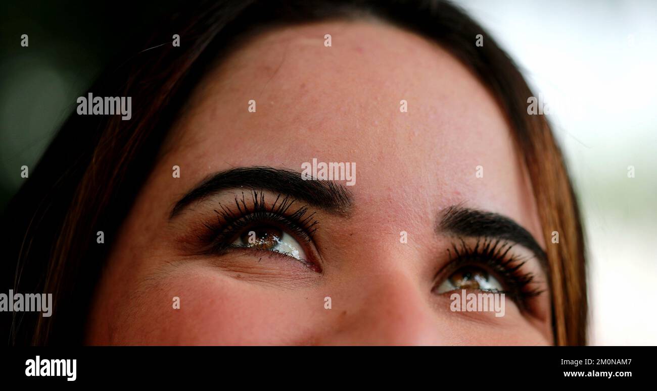 Young woman close-up face opening eyes to sky smiling Stock Photo - Alamy
