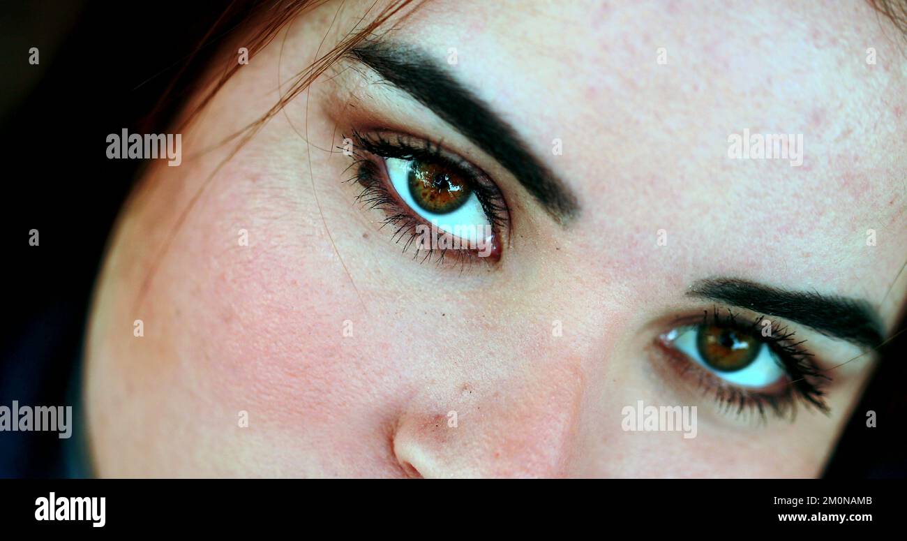 Young woman eyes staring at camera, macro close-up face Stock Photo - Alamy