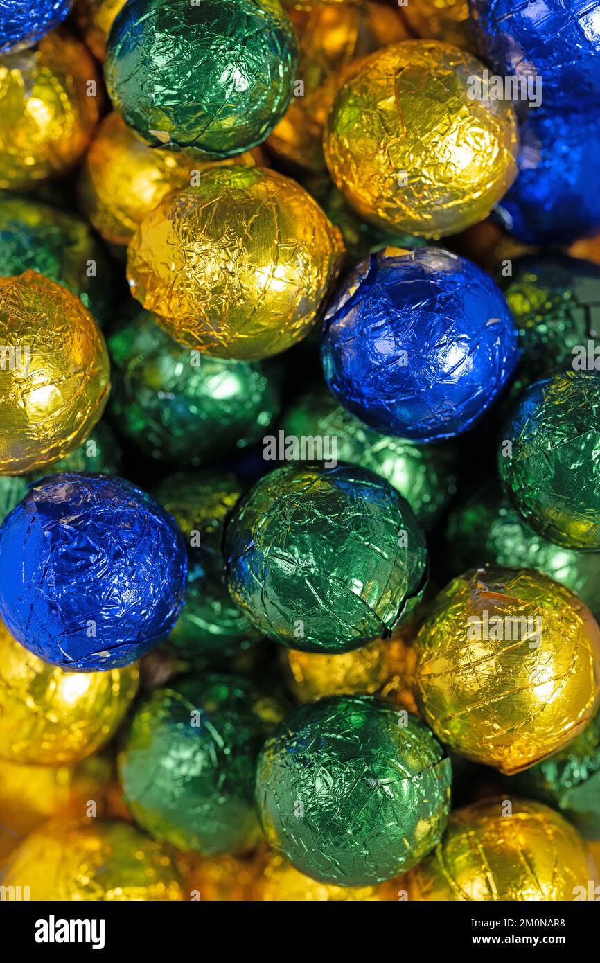 Chocolate balls wrapped in aluminum foil Stock Photo - Alamy