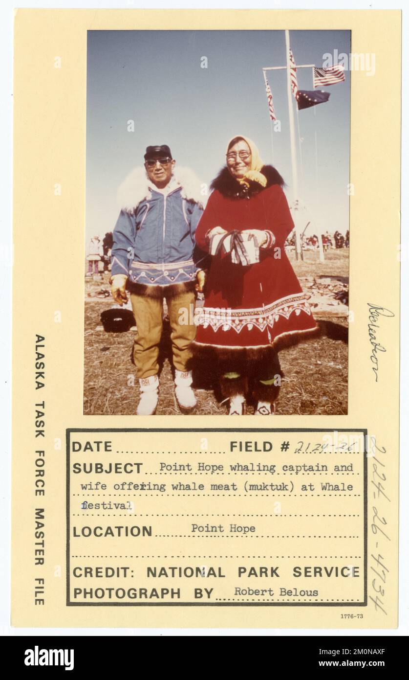 Point Hope whaling captain and wife offering whale meat (muktuk) at ...