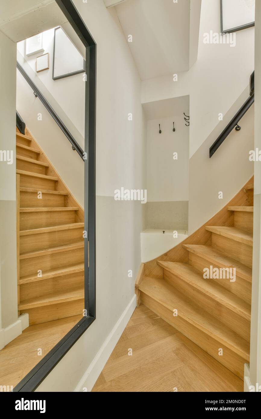 Interior of narrow corridor with radiator hanging on wall against ...