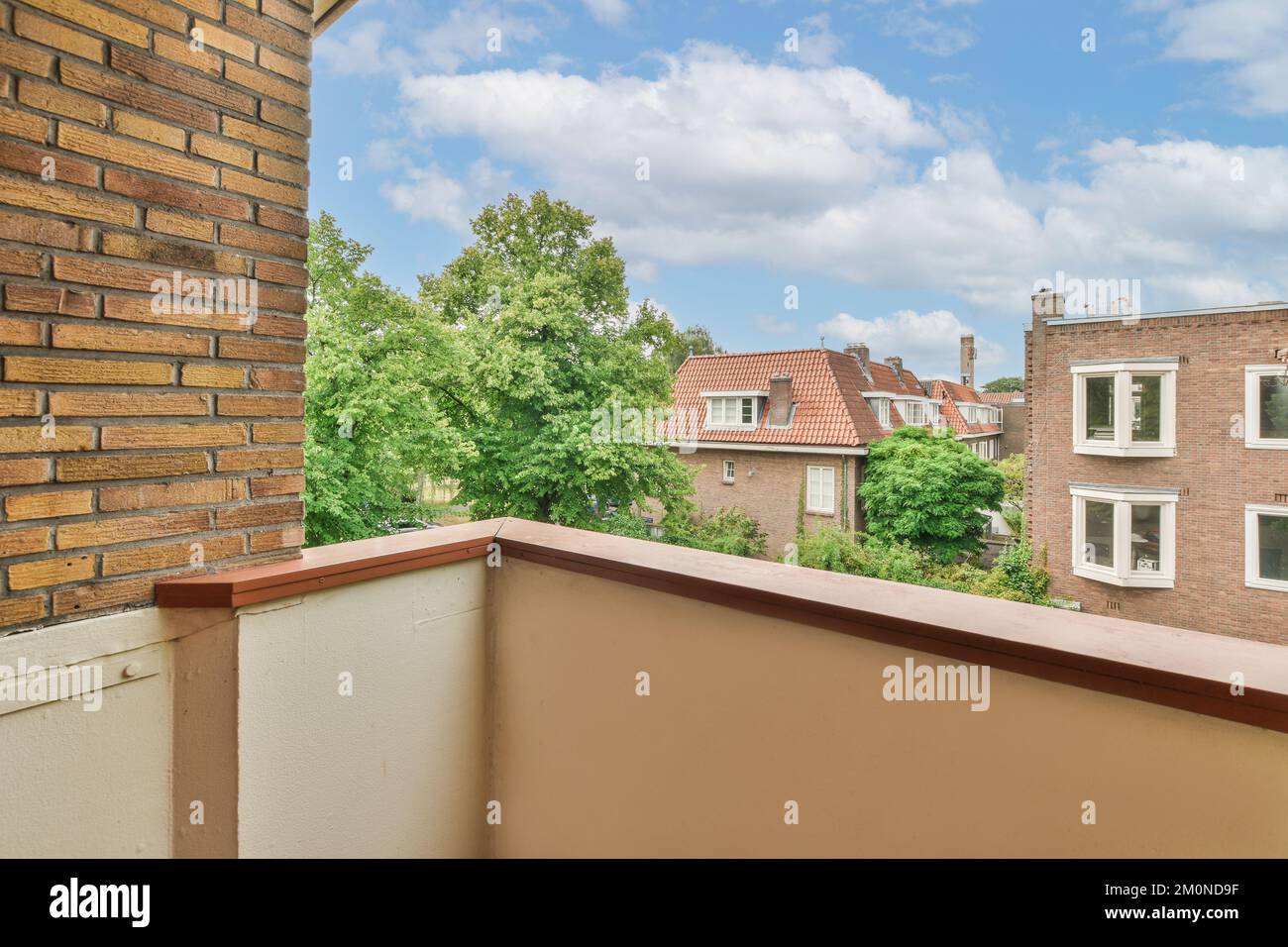 Panoramic view of buildings with trees from small balcony Stock Photo ...