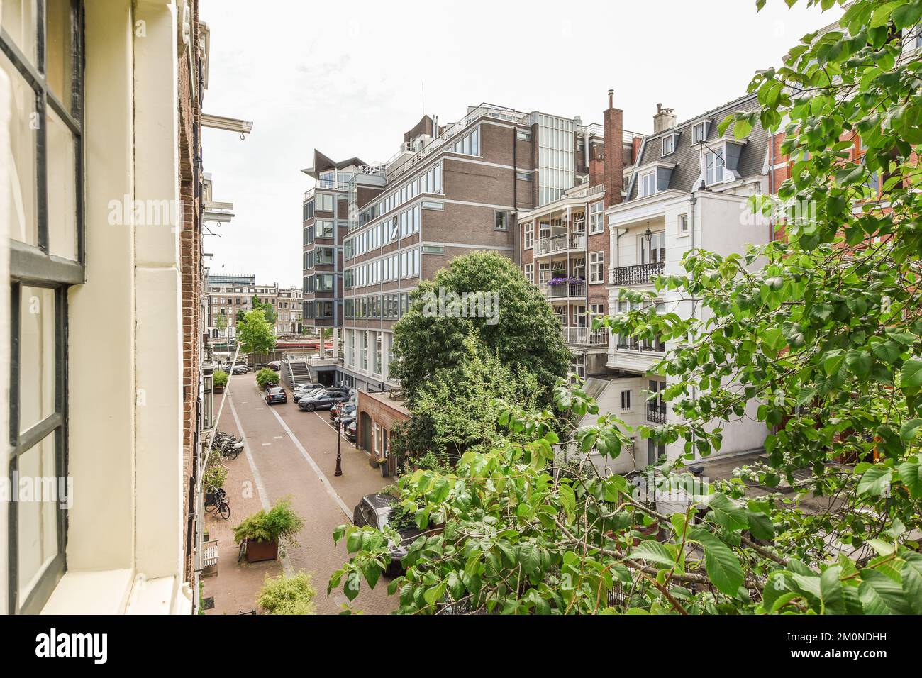 Panoramic view of buildings with trees from small balcony Stock Photo ...