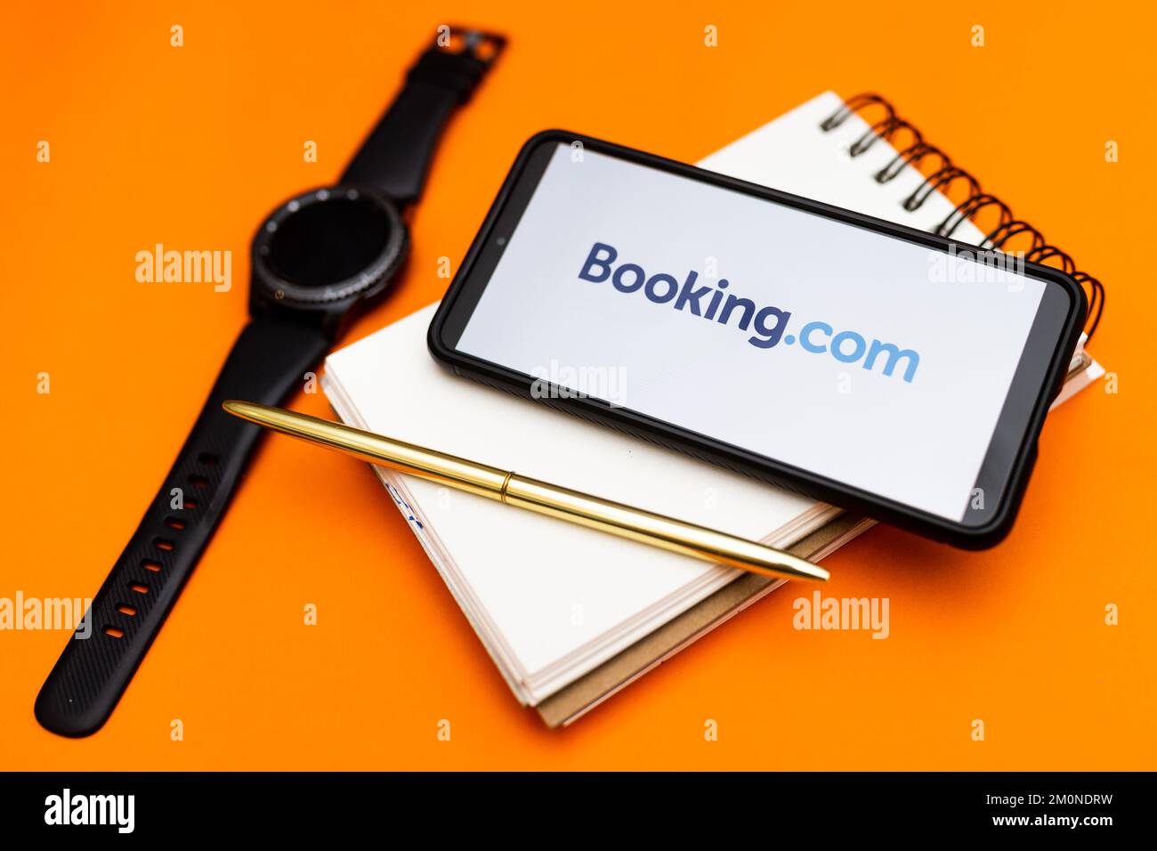 In this photo illustration a Booking.com logo seen displayed on a ...
