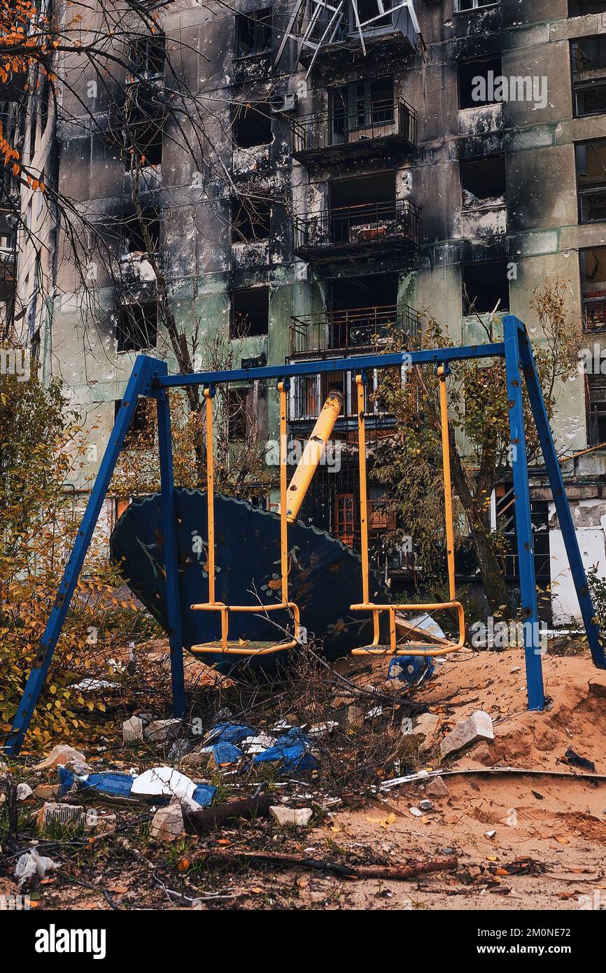 Playground after artillery shelling, Children's swings with traces of ...