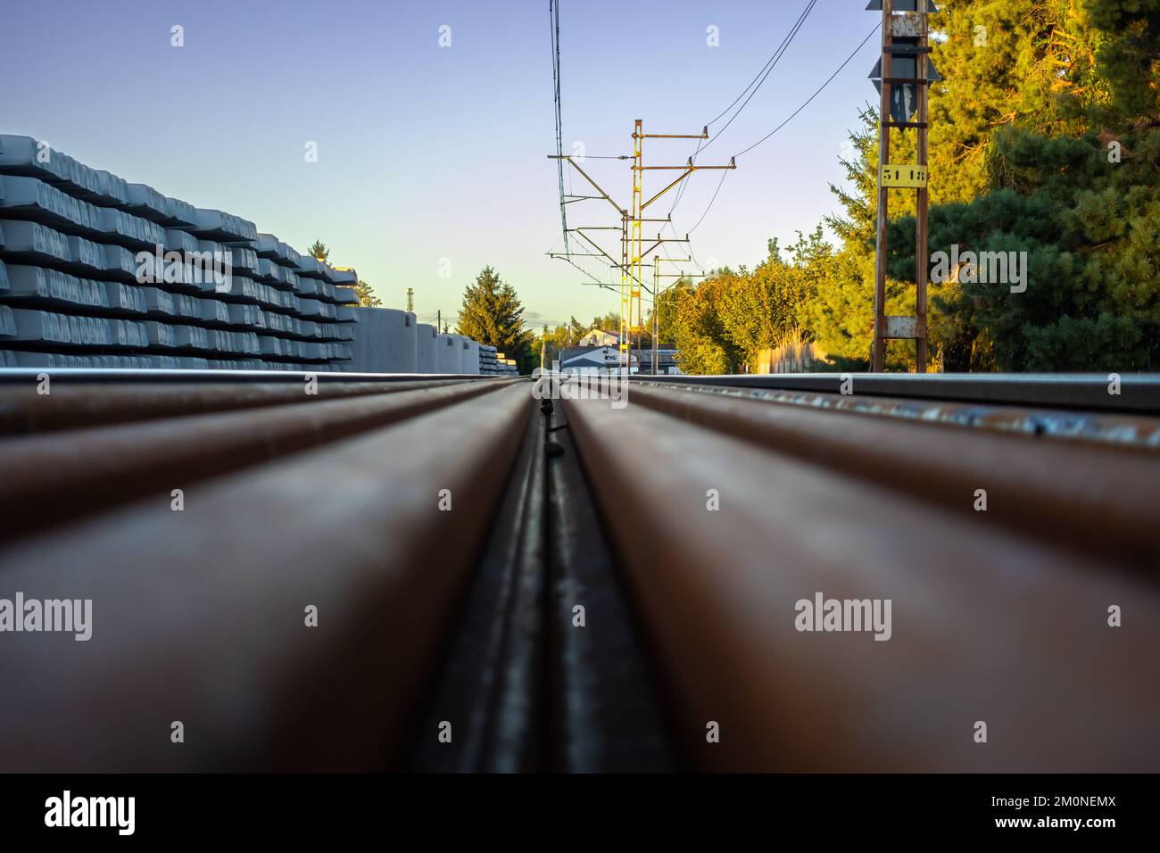 Expansion of railway lines. Train rails ready for laying and concrete ...
