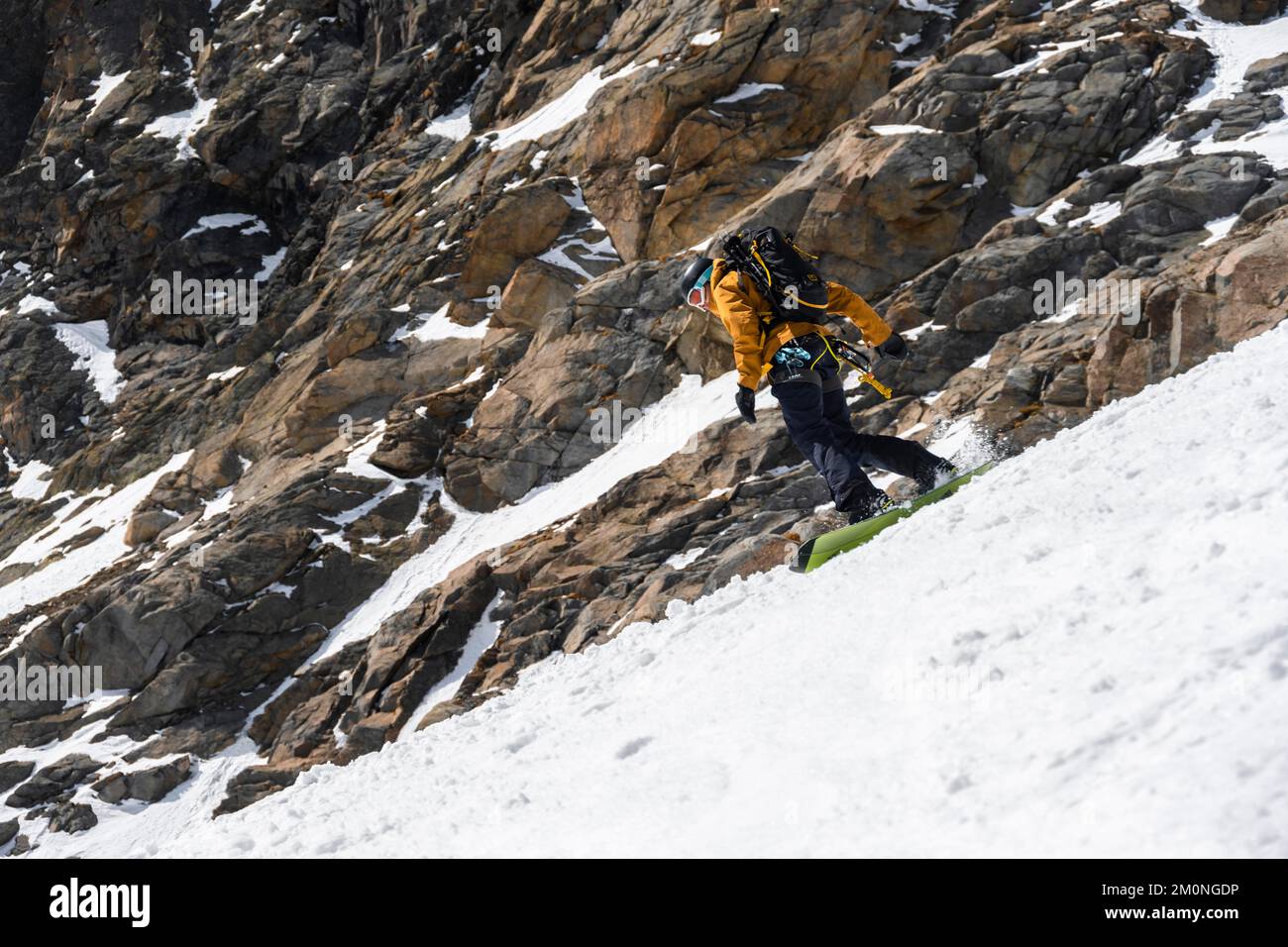 Skier descending a steep slope hi-res stock photography and images - Alamy