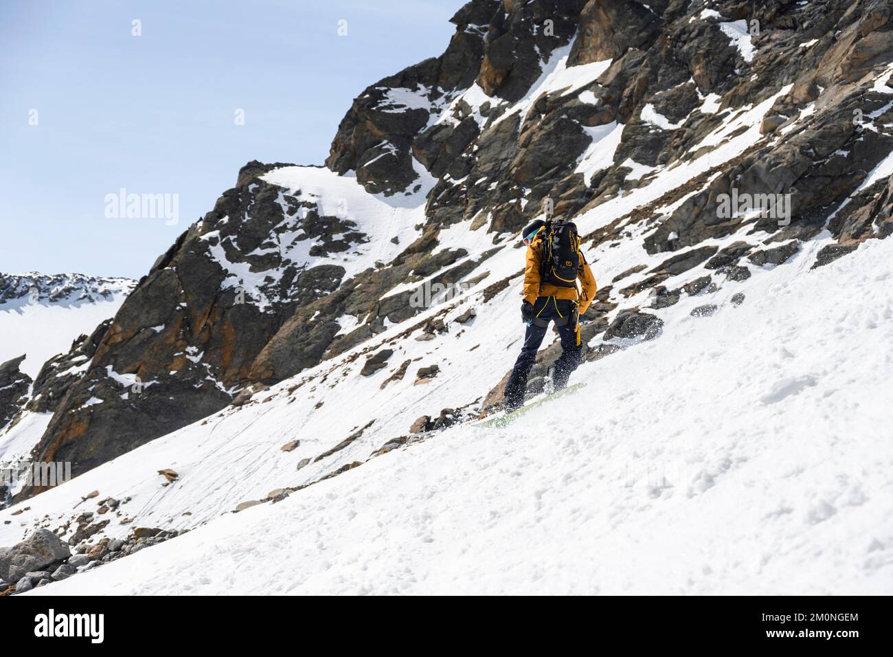 Skier descending a steep slope hi-res stock photography and images - Alamy