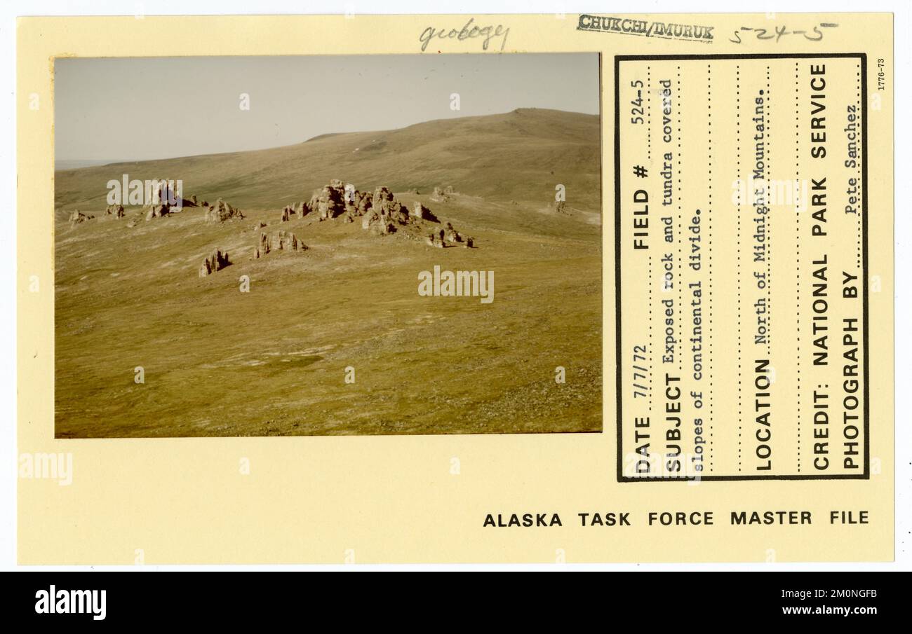 Exposed rock and tundra covered slopes of continental divide. Alaska ...