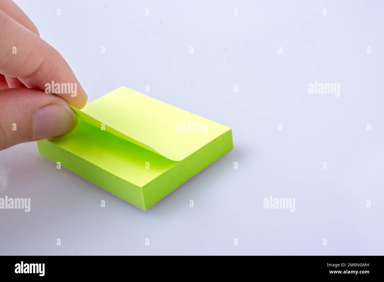 Post note office sticker for taking notes in hand Stock Photo - Alamy