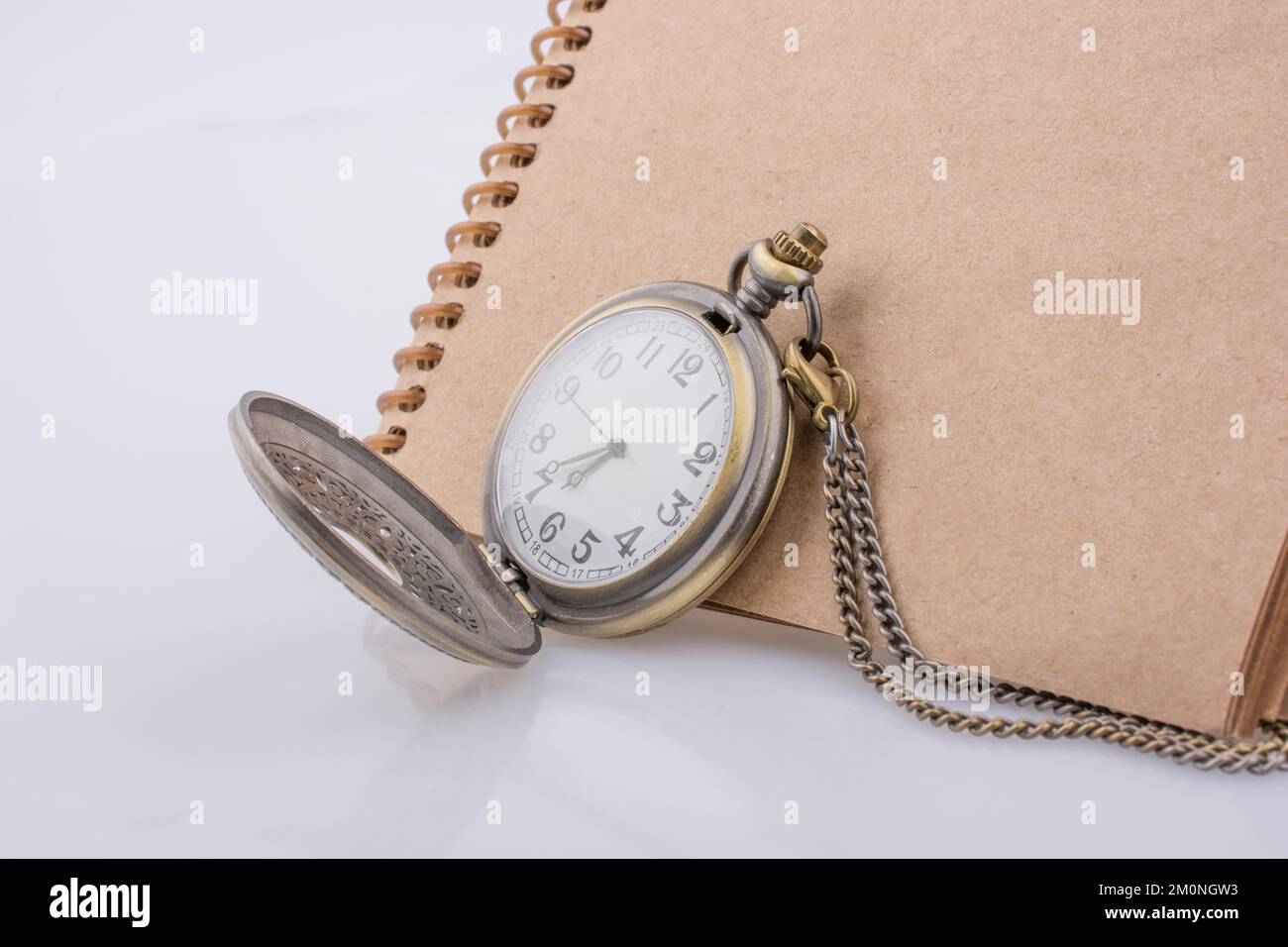 Retro style pocket watch on white background Stock Photo - Alamy