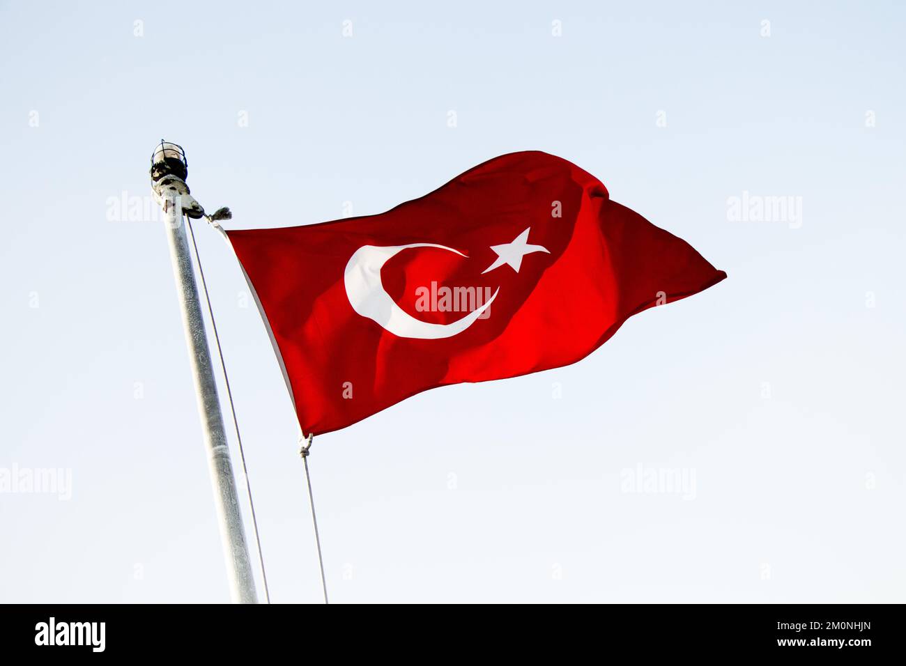 Turkish national flag hang on a pole in open air Stock Photo - Alamy