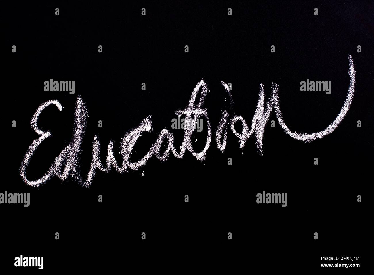 Hand written word EDUCATION with white chalk on black board Stock Photo ...