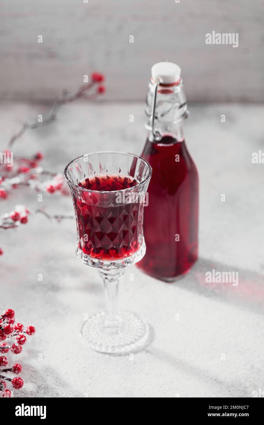 Homemade infused vodka, tincture or liqueur of red cherry Stock Photo ...