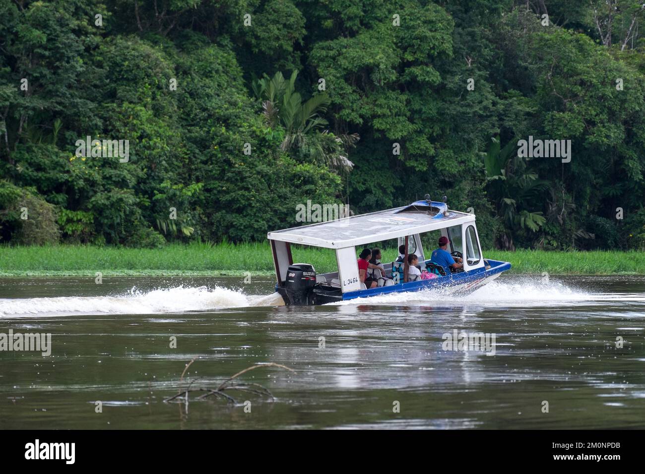 River taxi navigating the Tortuguero Canal in Costa Rica Stock Photo ...