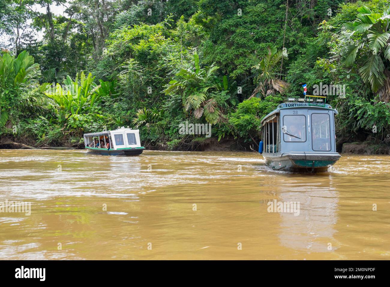Ships sailing through the Tortuguero Canal in Costa Rica Stock Photo ...