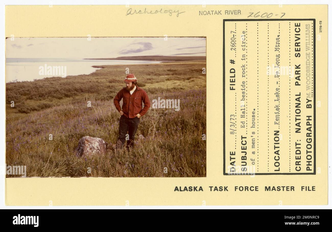 Ed Hall, beside rock in circle of a men's house. Alaska Task Force ...
