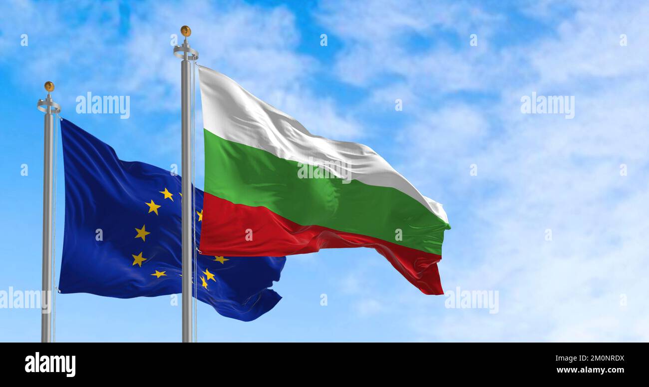 the flags of Bulgaria and the European Union waving in the wind on a ...
