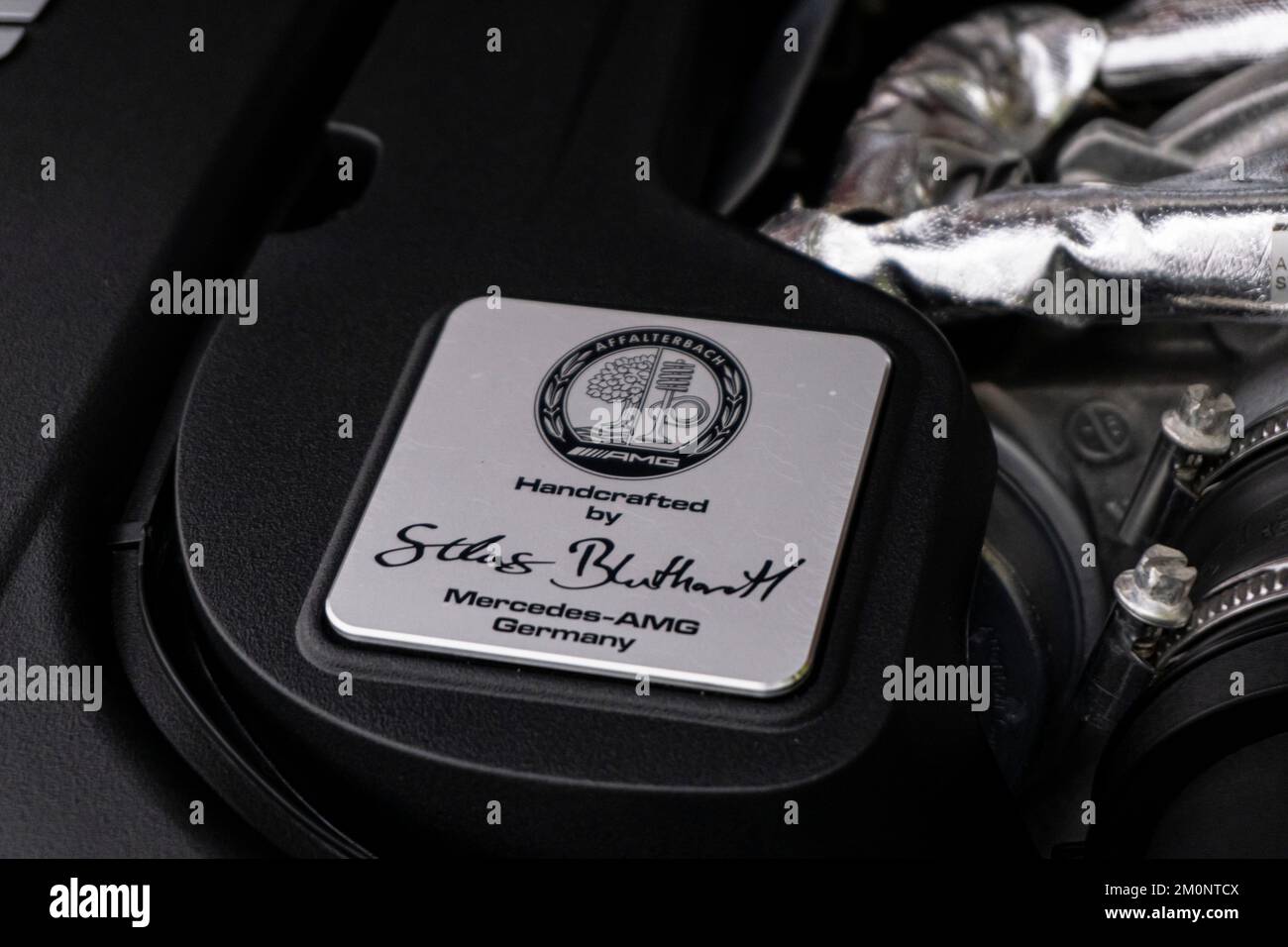 A closeup shot of the AMG Hand Built plaque on engine bay Stock Photo ...
