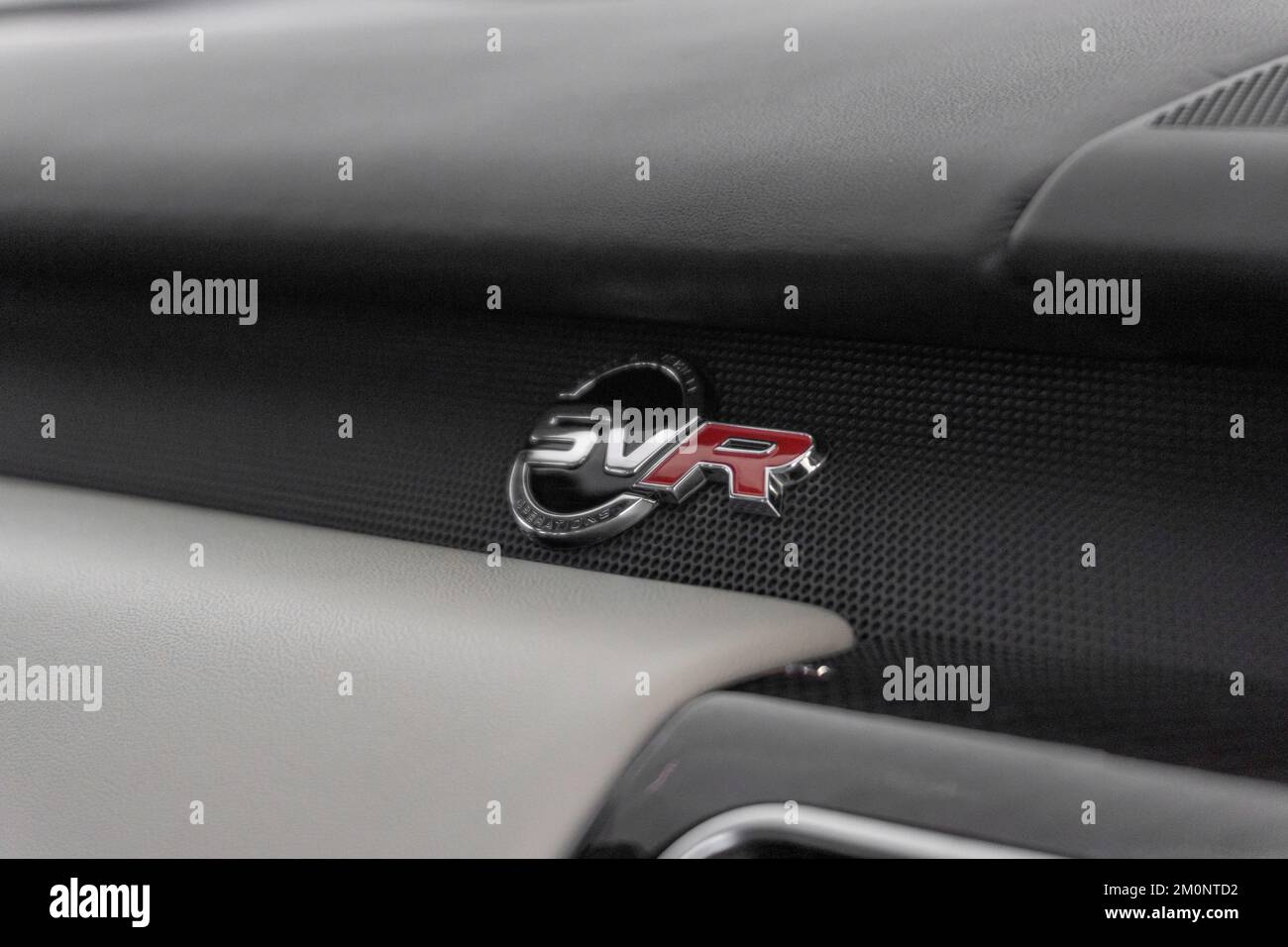 A closeup shot of the Range Rover Sport SVR Dashboard SVR Badge, black ...