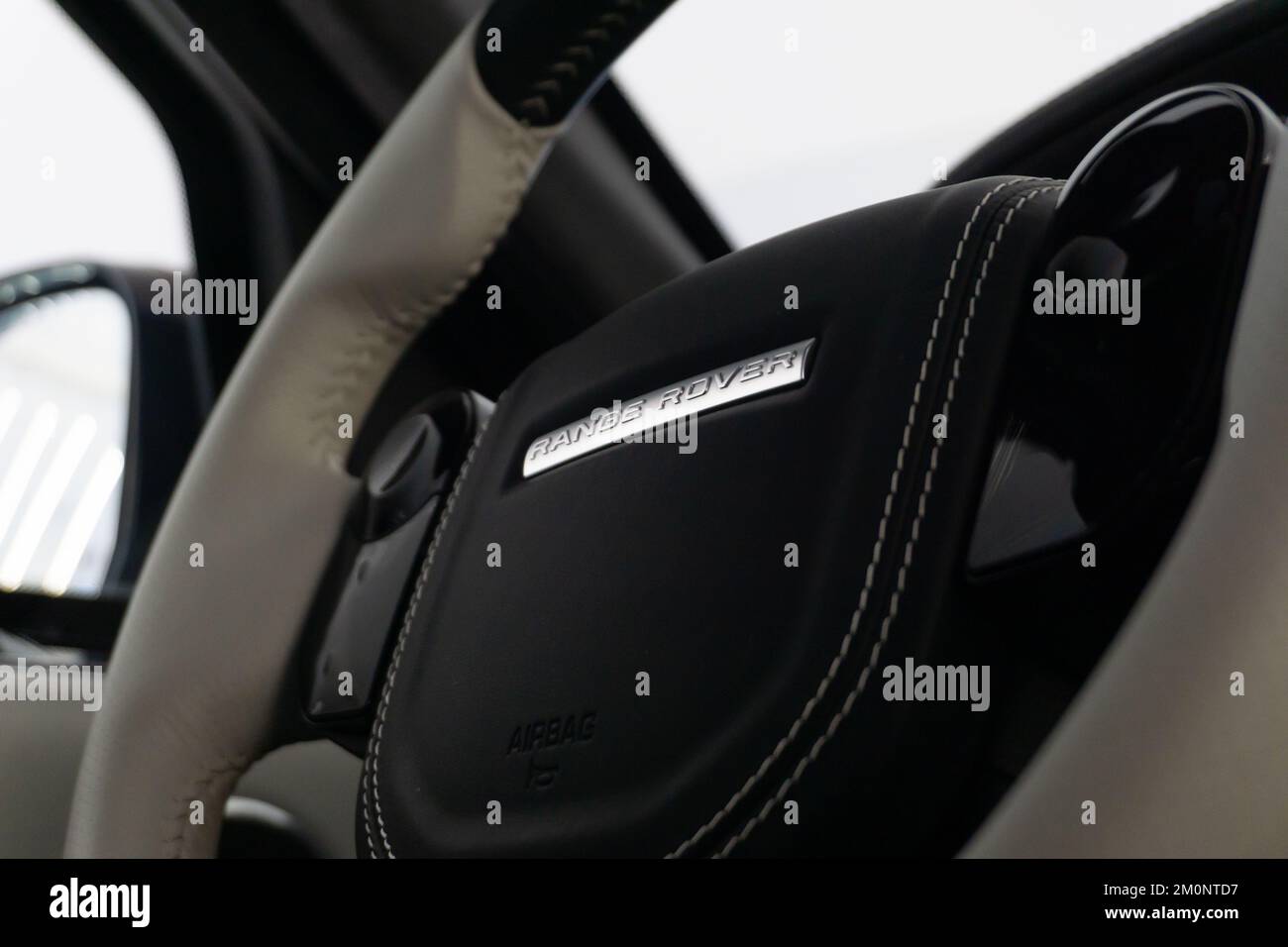 A closeup shot of the Range Rover Sport SVR Steering wheel on black and ...