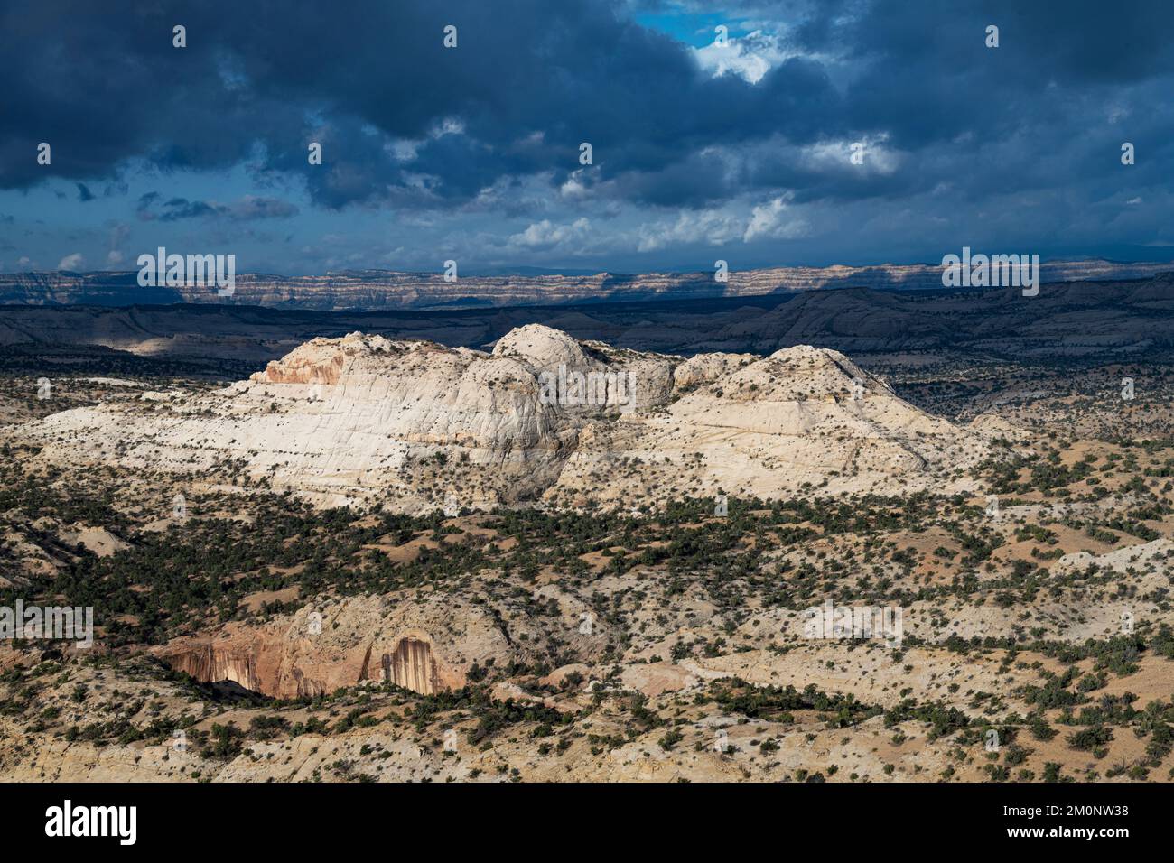 Light flows in under storm clouds in the late morning sky illuminating ...