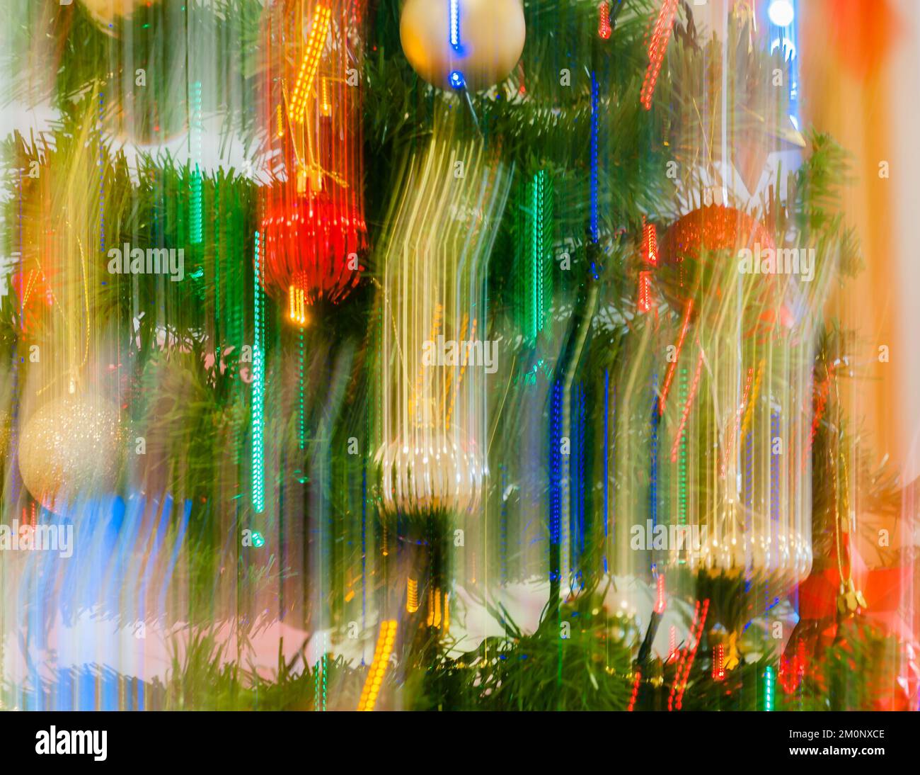 Photograph of shiny christmas tree objects illuminated by dynamic ...