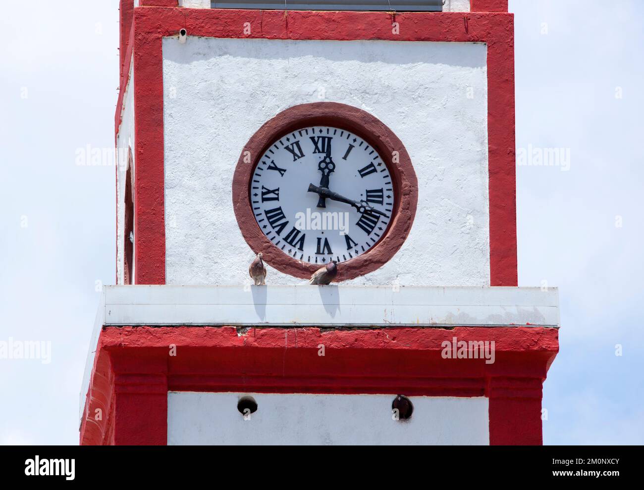 The close view of a clock in the main square of San Miguel resort town ...
