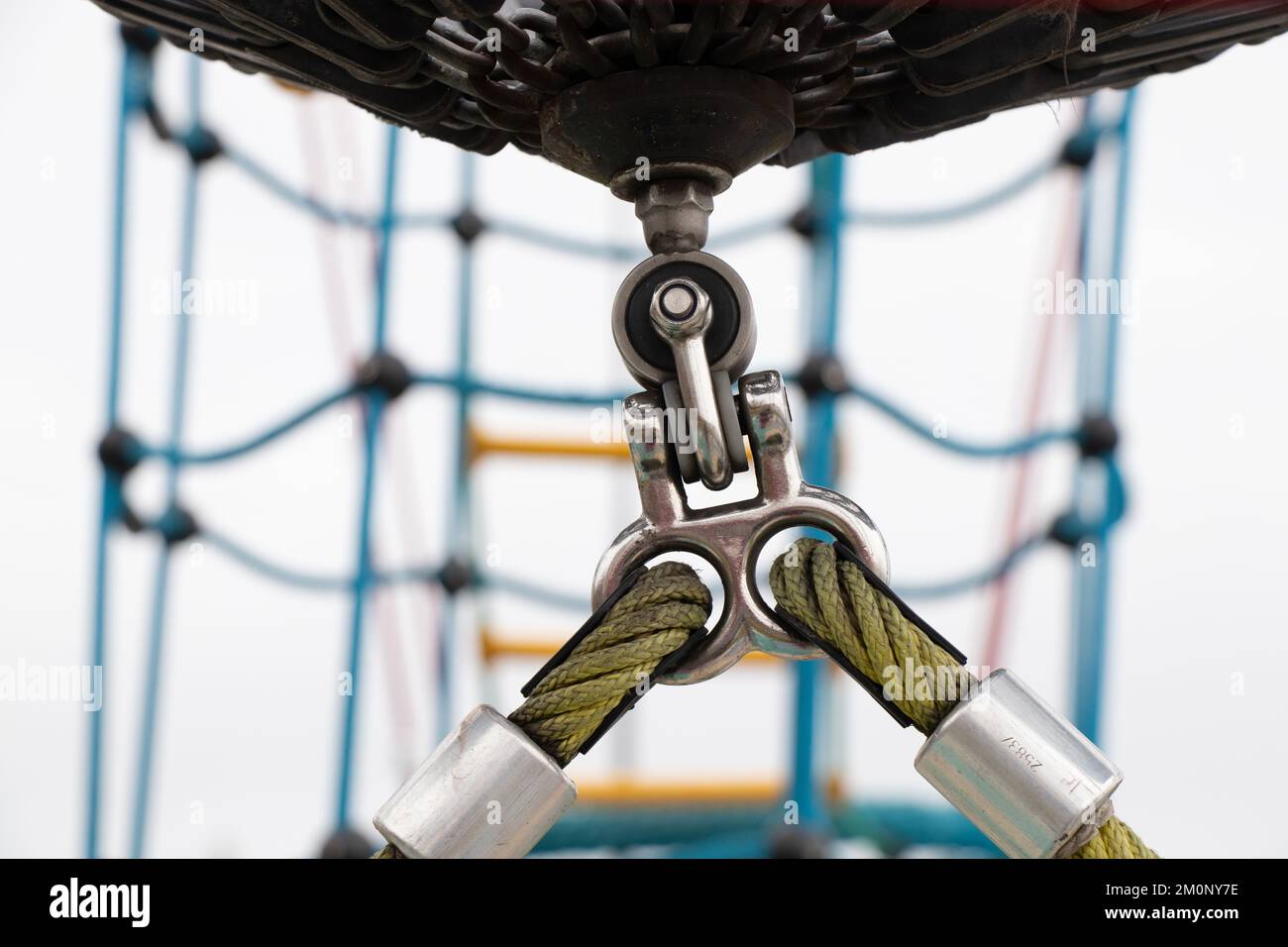 Children's rope swing with fasteners close-up, connecting part with a ...