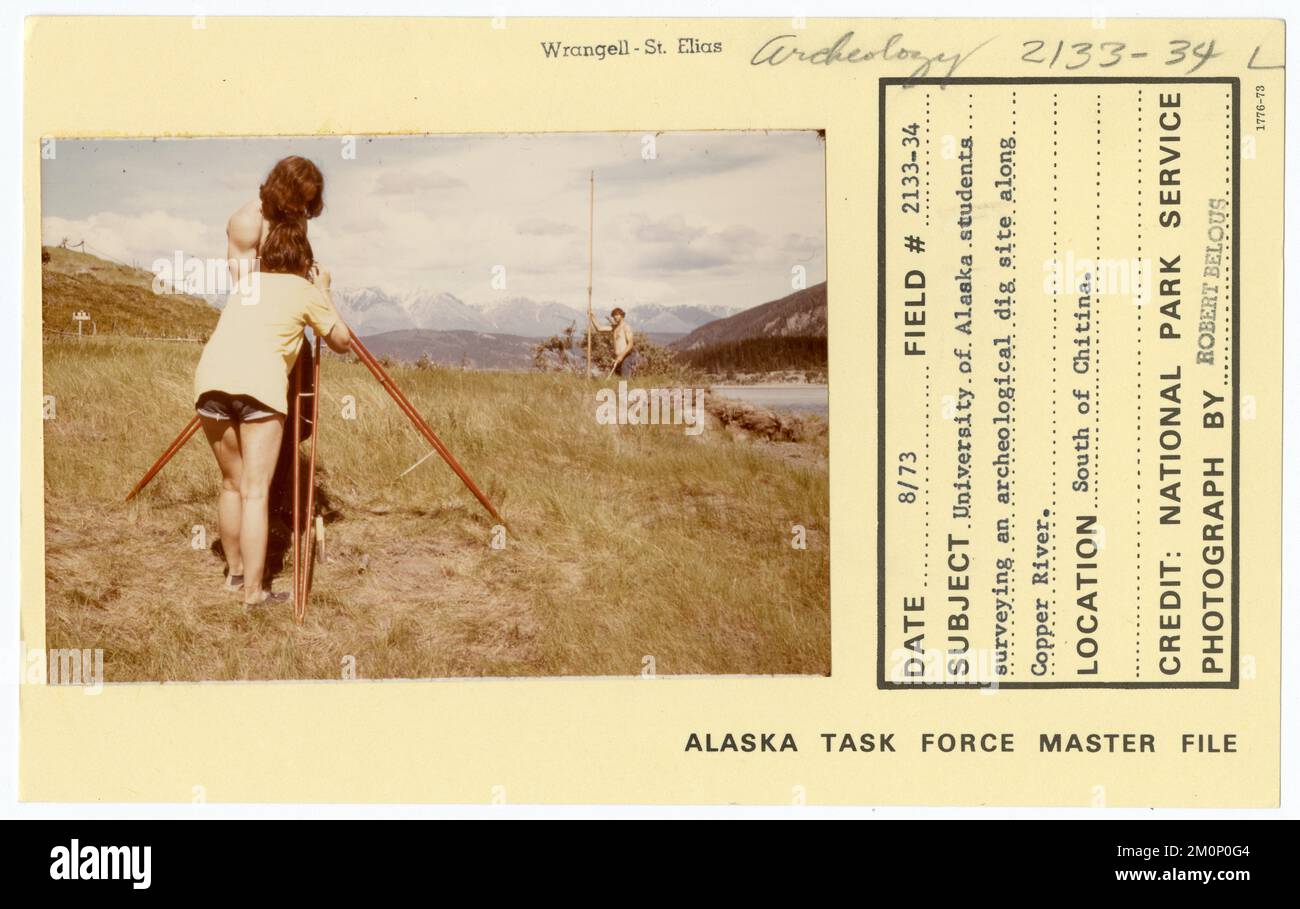 University of Alaska students surveying an archeological dig site along ...