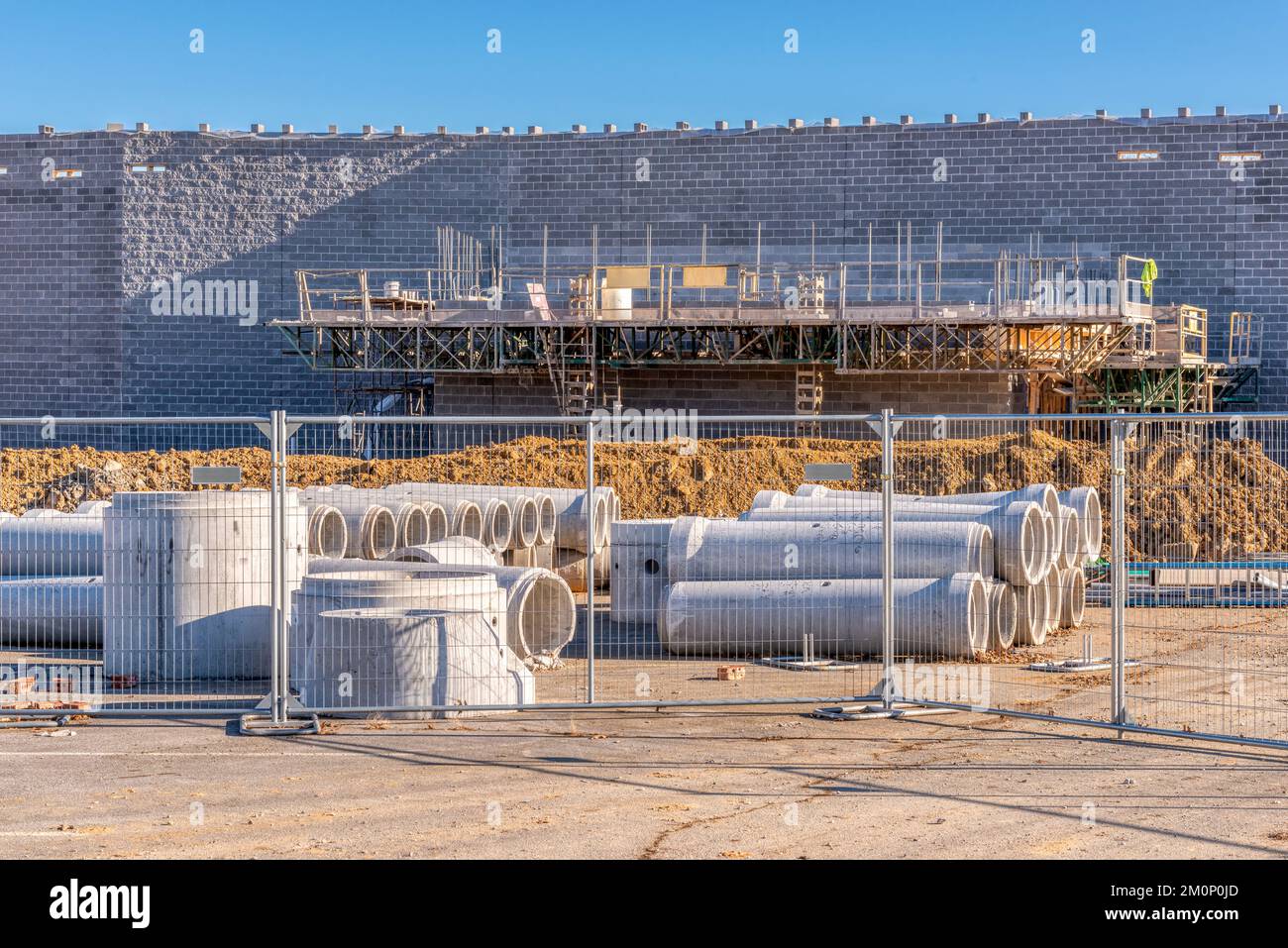 Horizontal shot of a security fence around a commercial retail ...
