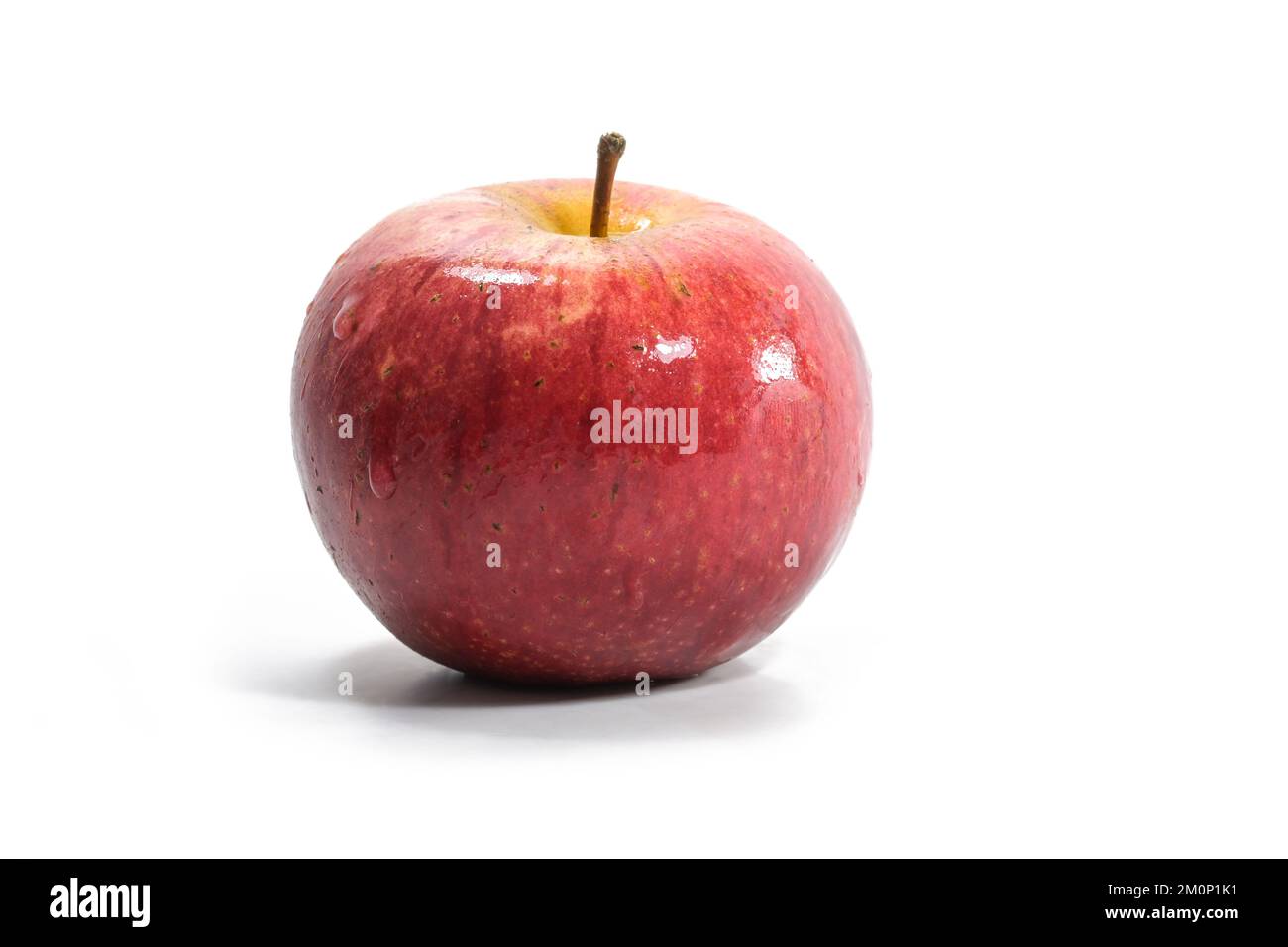 Fresh organic red apple with water drops on the skin, isolated with ...