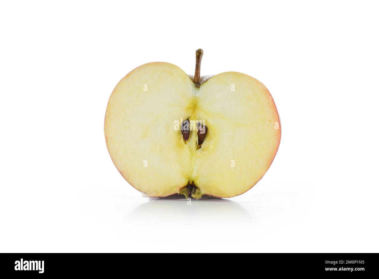 Half fresh organic apple with fruit pulp, seeds and stem, isolated with ...