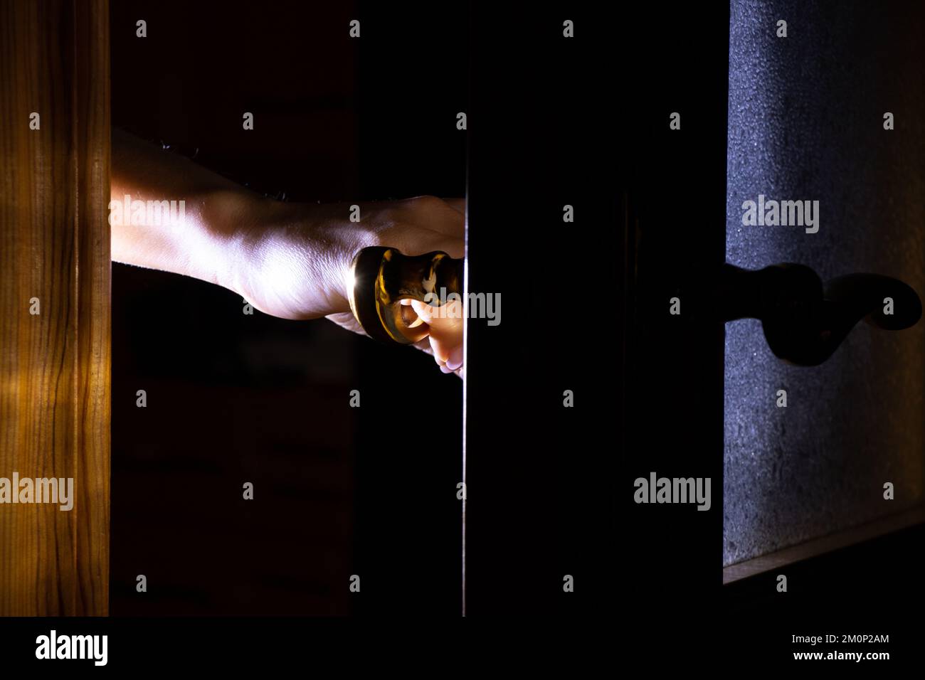 Hand doorknob dark hi-res stock photography and images - Alamy