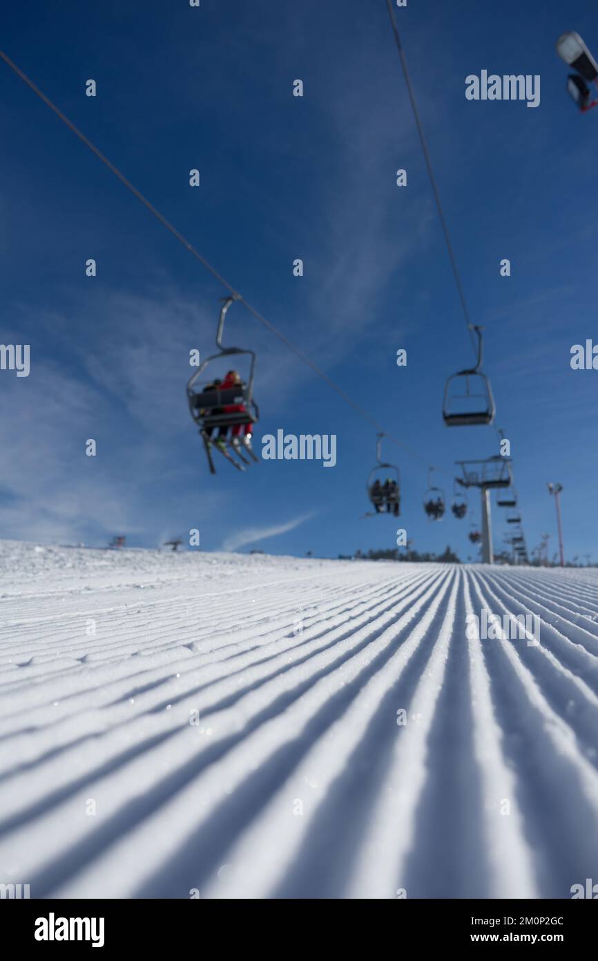 Beautiful view of winter resort with cable car and geometry track lines ...