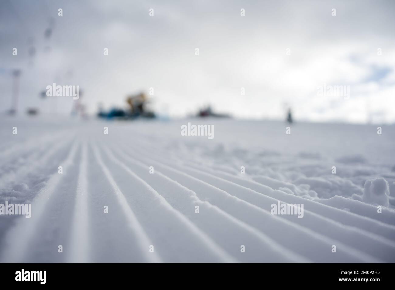 Geometry track lines on a ski slope left by a snowcat as a texture ...