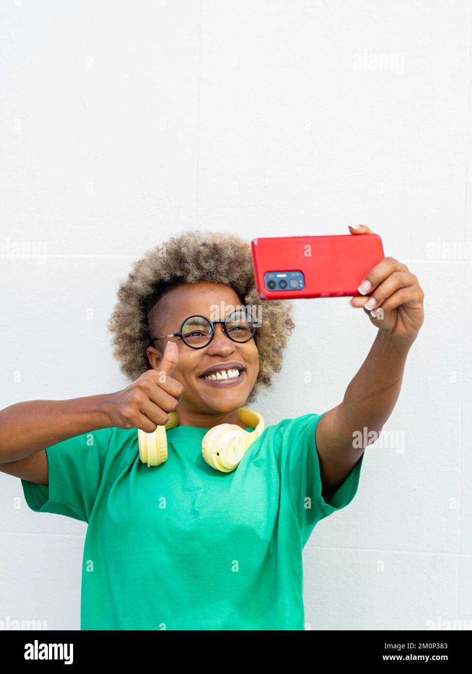 Smiling african woman taking selfie hi-res stock photography and images ...
