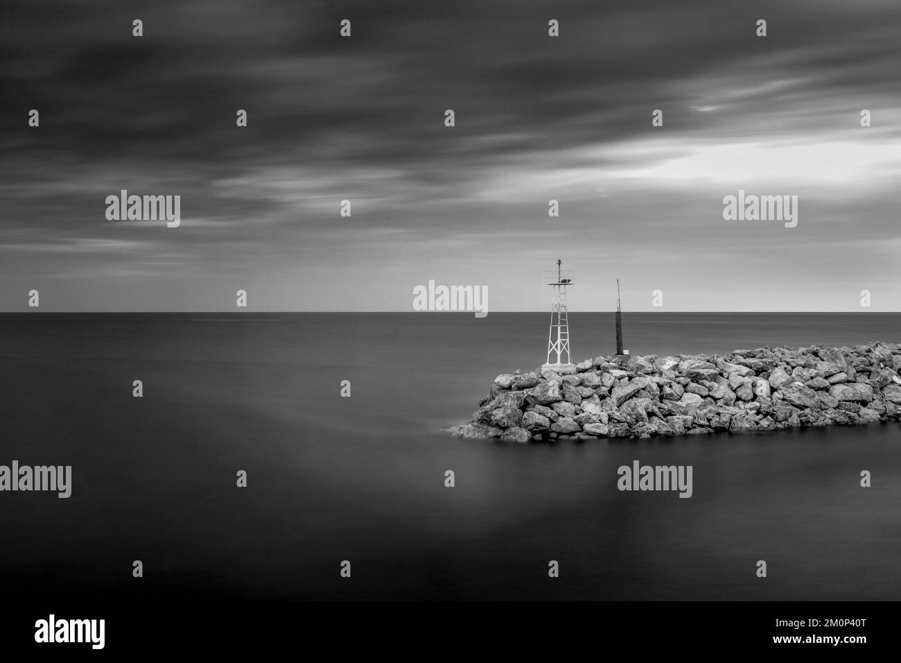 Infrared black and white long exposure seascape of Agiokampos harbor ...