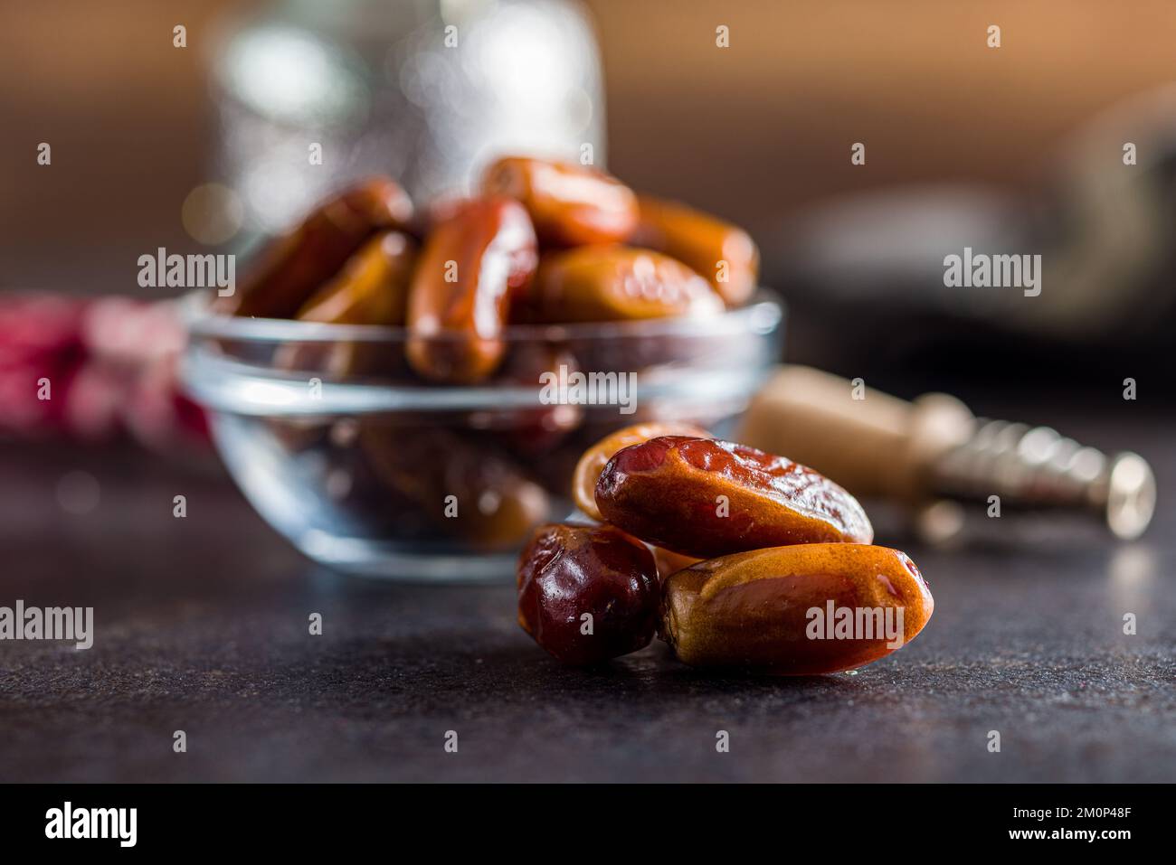 Dried dates fruit on the black table Stock Photo - Alamy