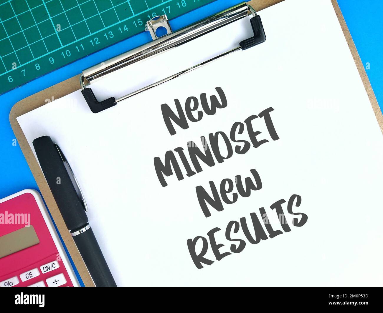 A new mindest, new results quote on A4 paper with blue background Stock ...