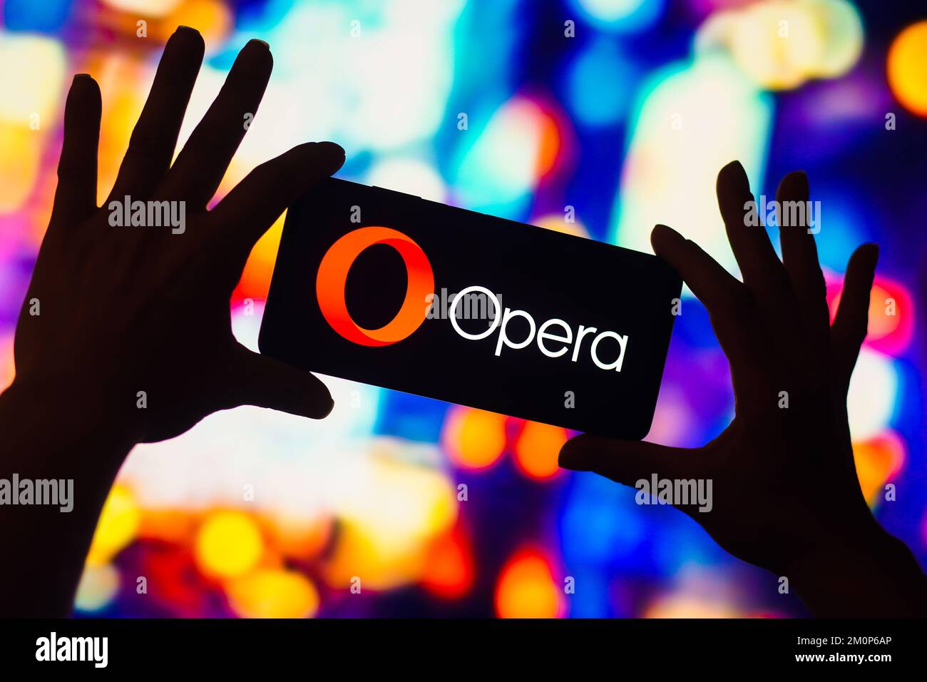 In this photo illustration, the Opera Limited logo is displayed on a smartphone screen Stock ...