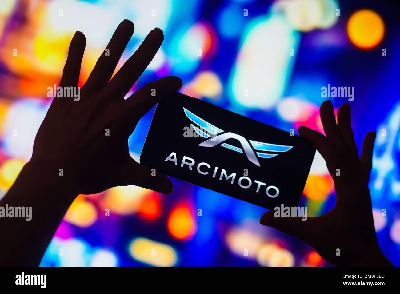 In this photo illustration, the Arcimoto logo is displayed on a ...