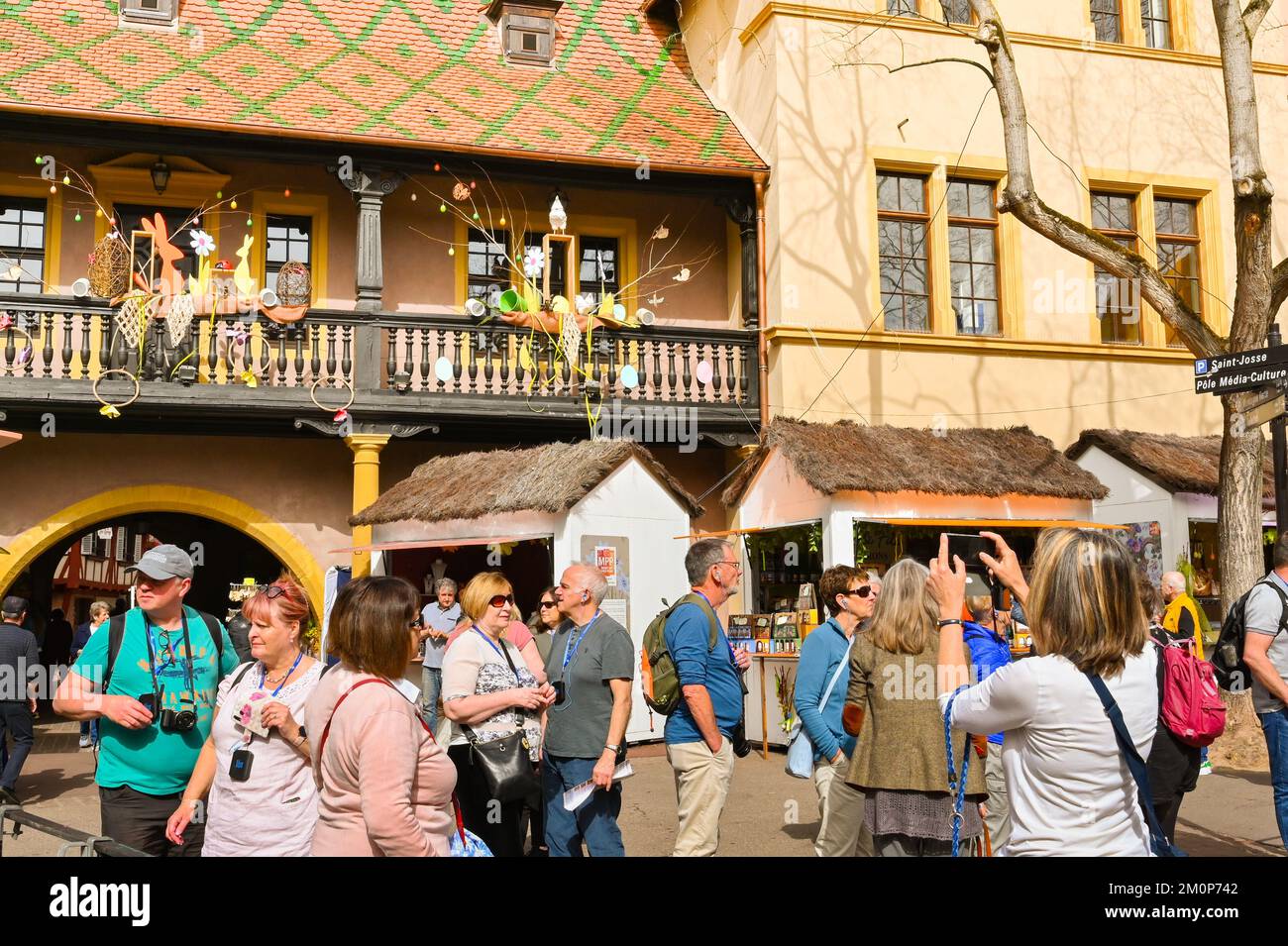 Colmar, France - April 2022: Touriusts outside one of the decorated ...