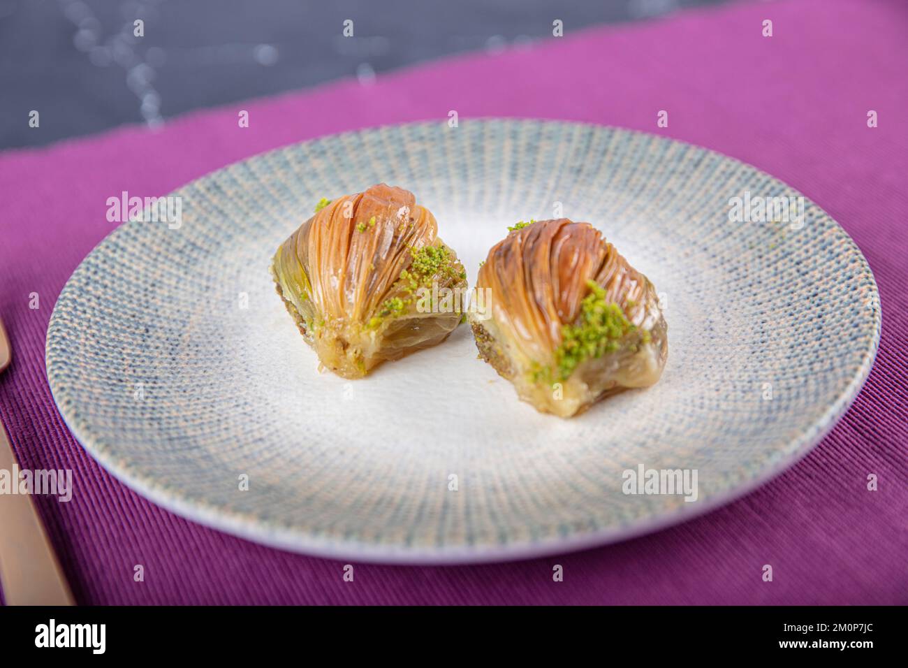 Slice of mussel baklava. Special Turkish baklava in the shape of ...